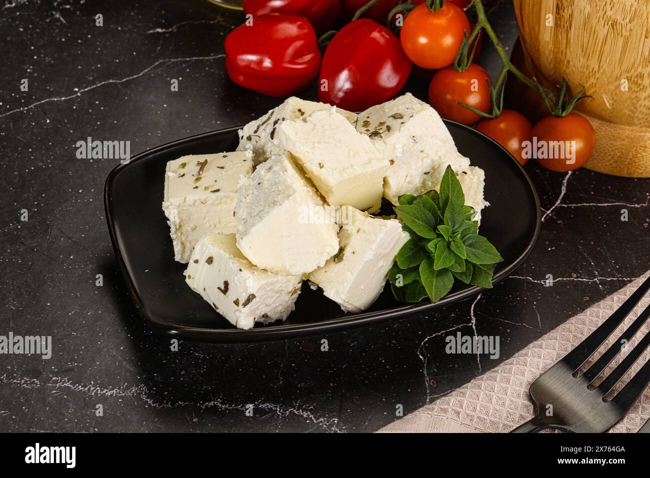 Greek traditional Feta cheese cubes with herbs and spices Stock Photo ...