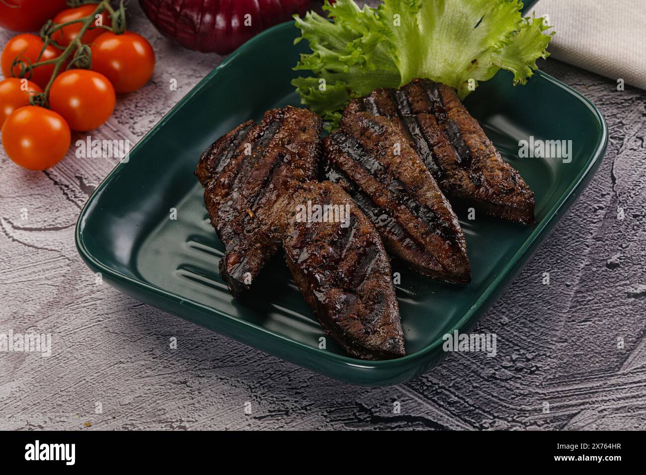 Grilled diet beef liver steak in the plate Stock Photo - Alamy
