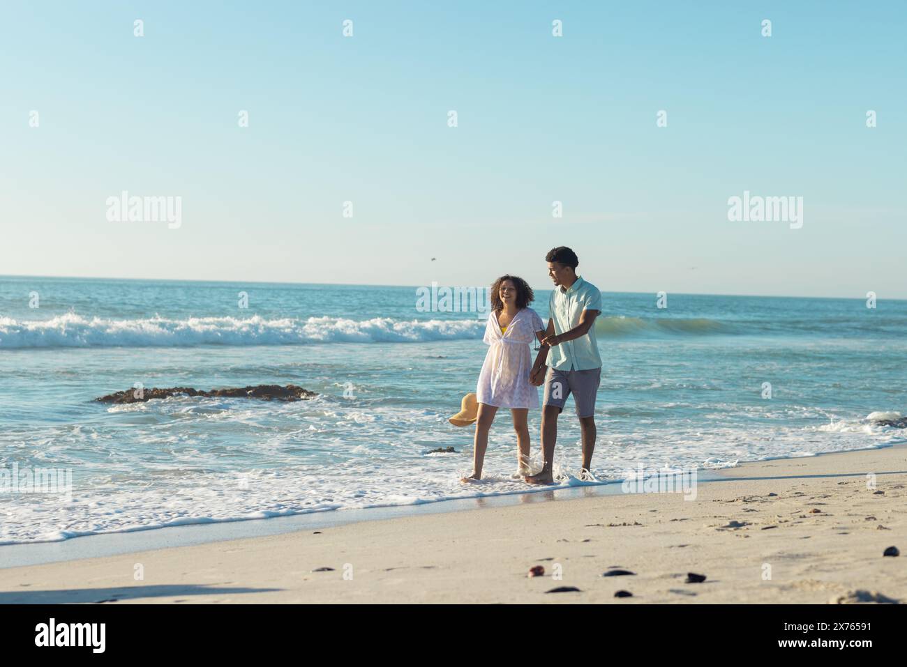 Couple hugging from behind laughing hi-res stock photography and images ...