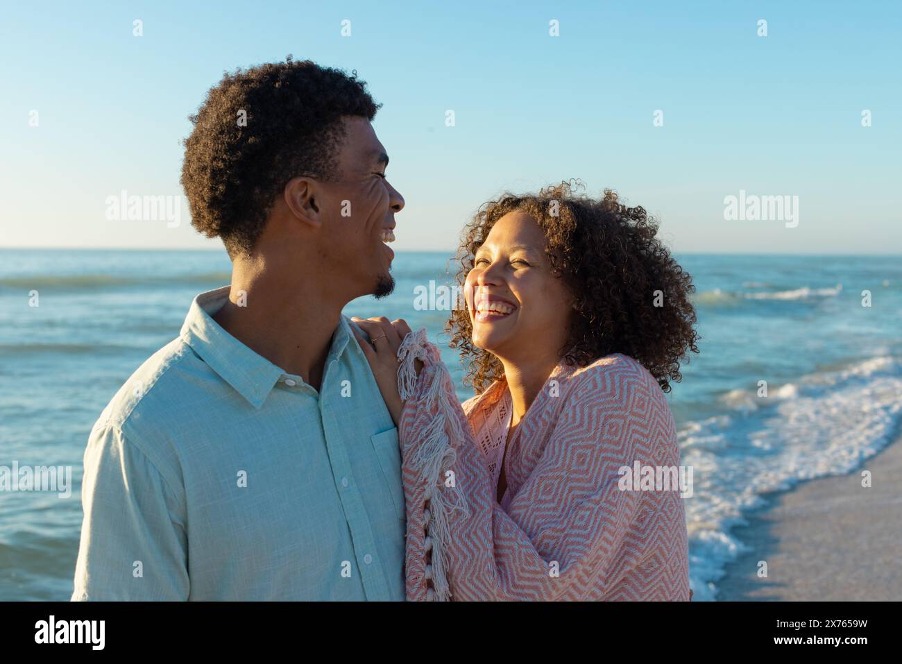 Diverse couple laughing standing hi-res stock photography and images ...