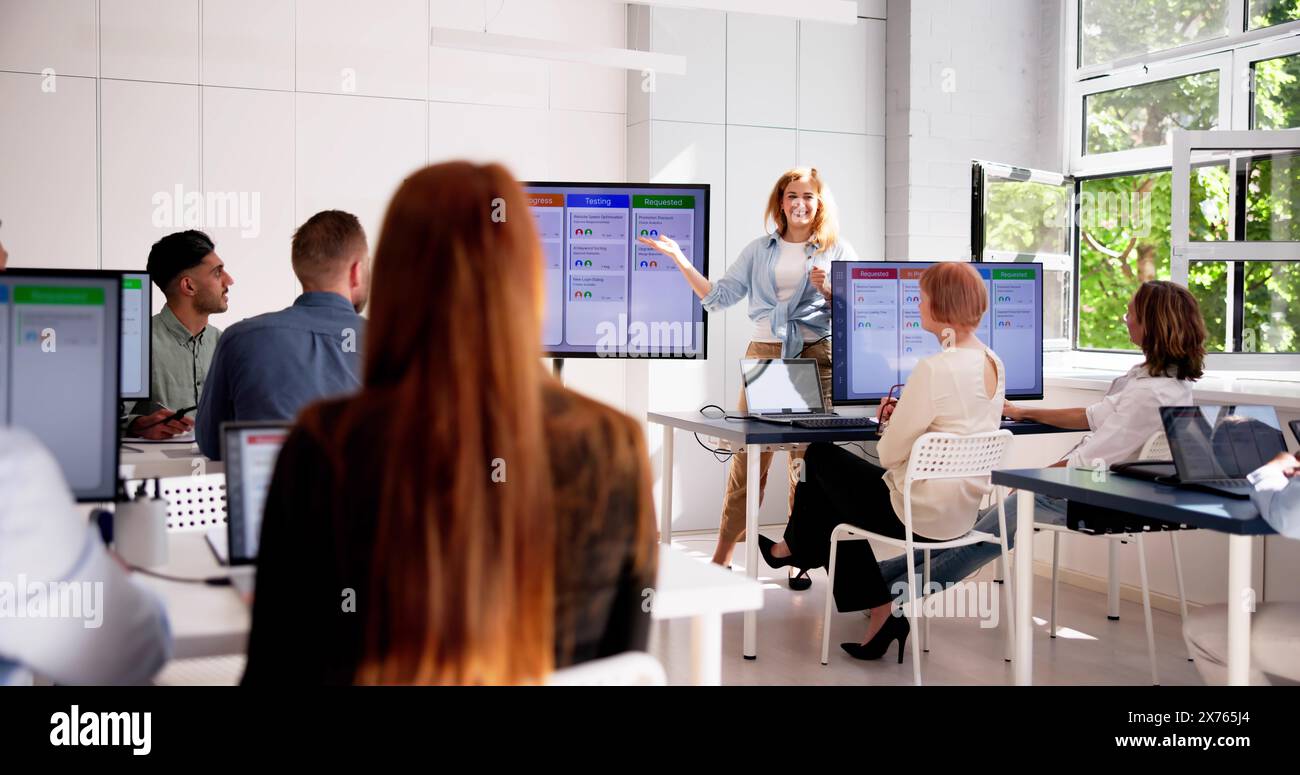 Corporate Training In A Black Classroom With Computer Background Stock ...