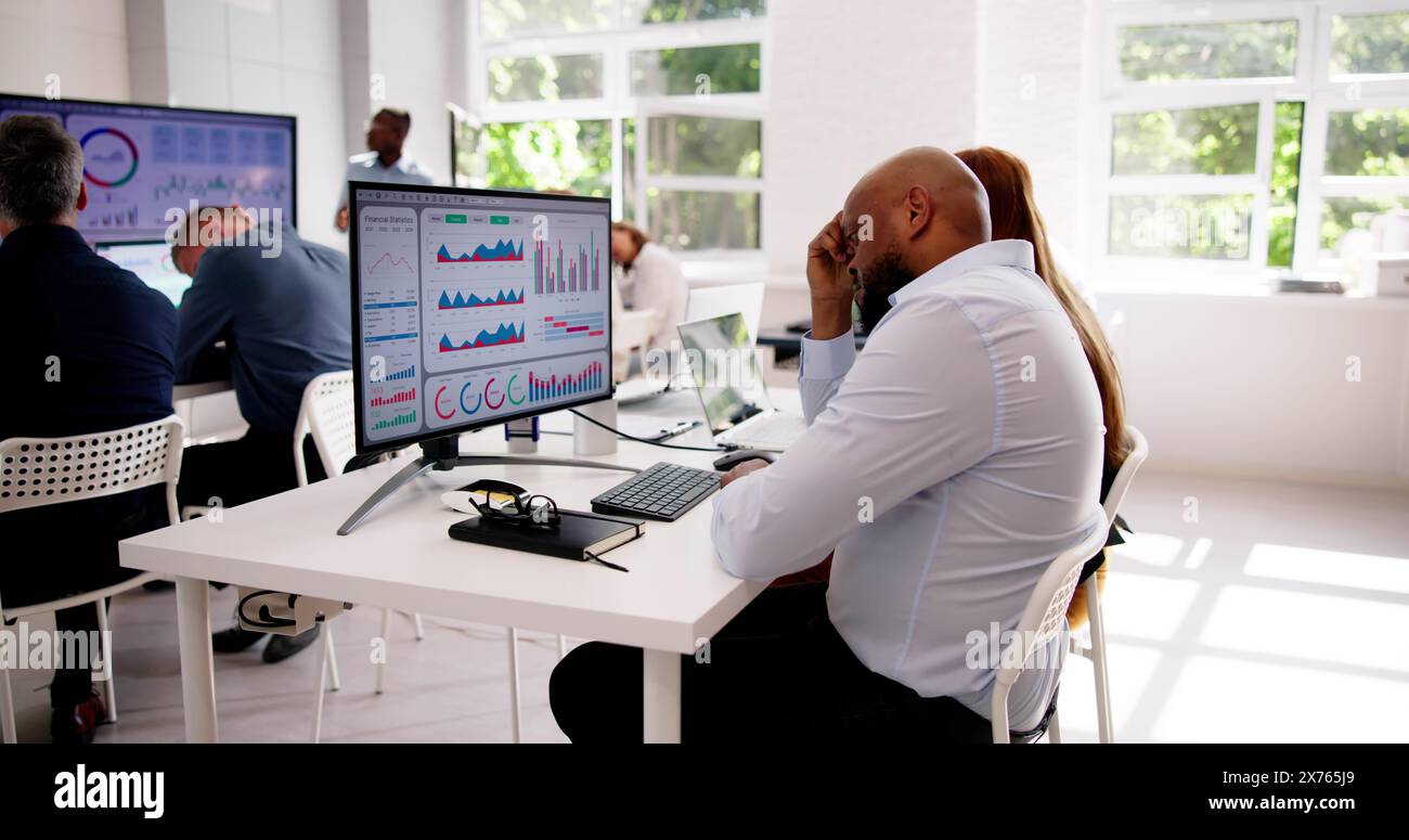 Distracted Employee In Office Team Meeting. Sad Worker Stock Photo - Alamy