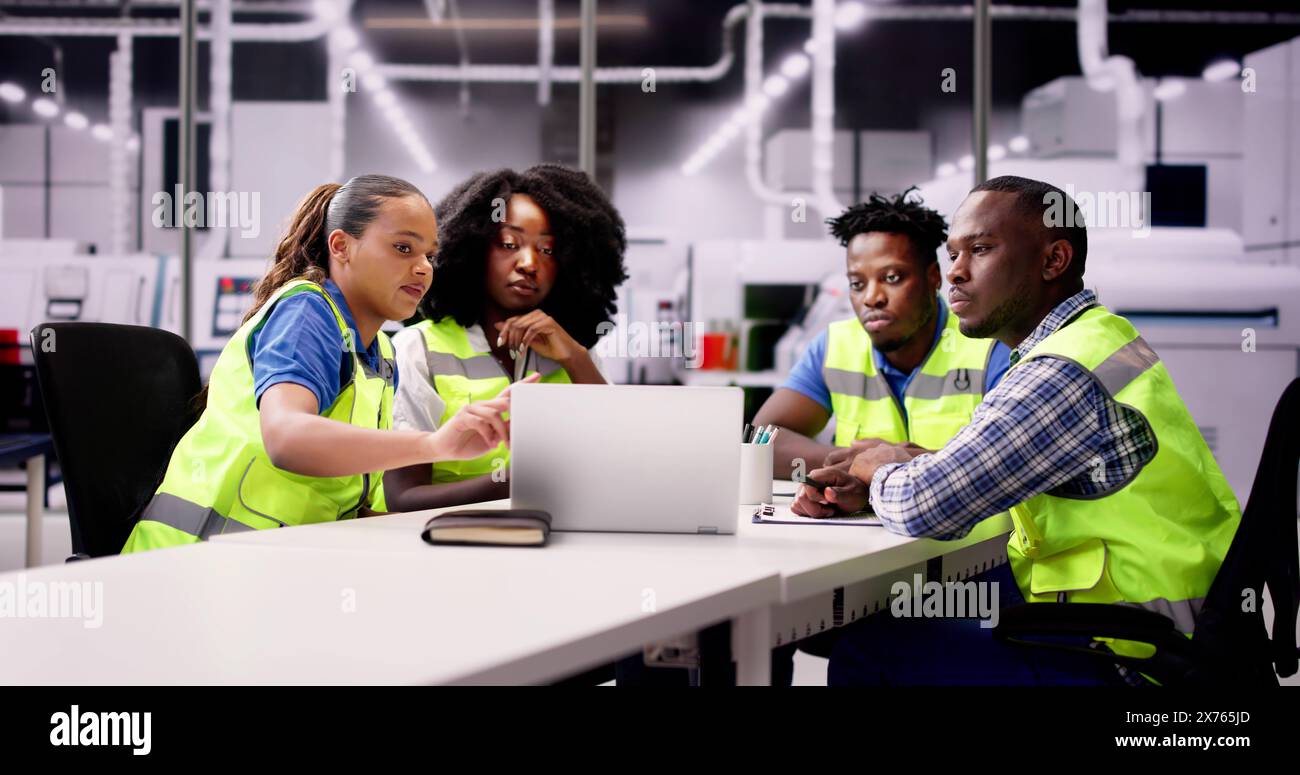 Team Of Engineers Talking At Industrial Workplace Stock Photo - Alamy