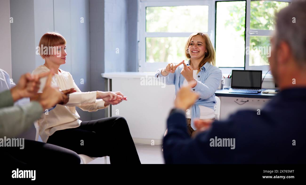 Group Of Young People Learning Deaf Gesture Sign From Woman Stock Photo ...