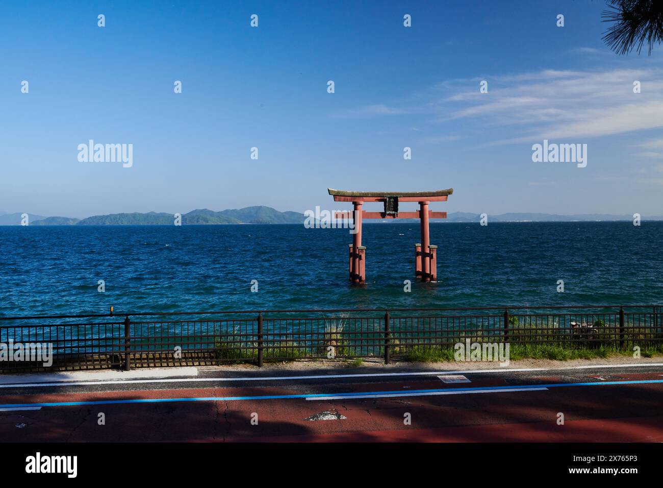 The torii gate of the Shirahige shrine is situated in the waters of ...