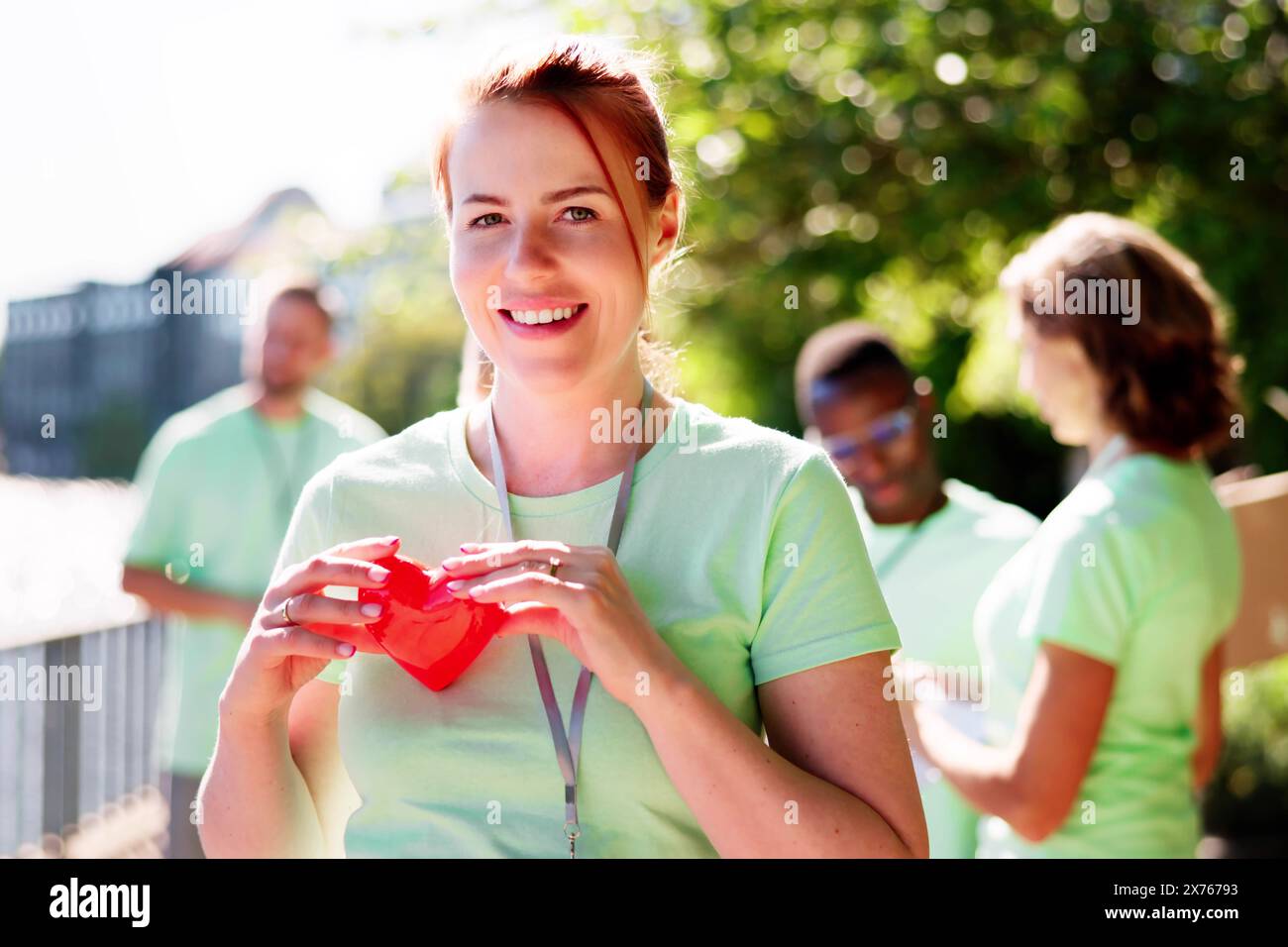 Volunteer Holding Heart Symbol Shape, Social Care Stock Photo - Alamy