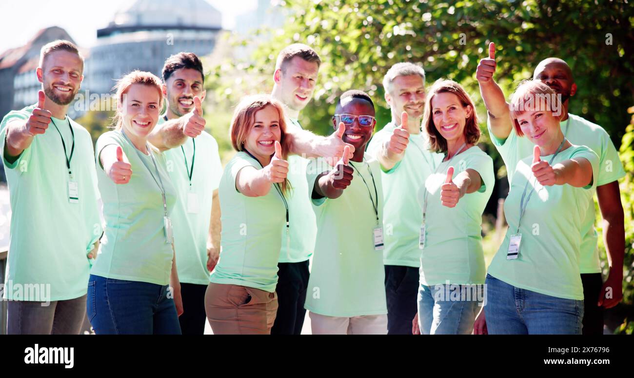Happy Volunteer Group Celebrate. Altruism And Teamwork Stock Photo - Alamy