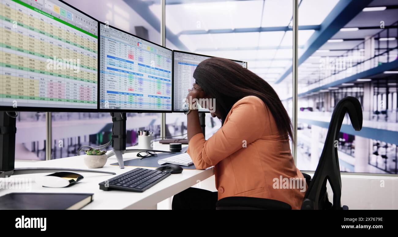 Data Analyst African Woman Using Spreadsheet On Computer Stock Photo ...