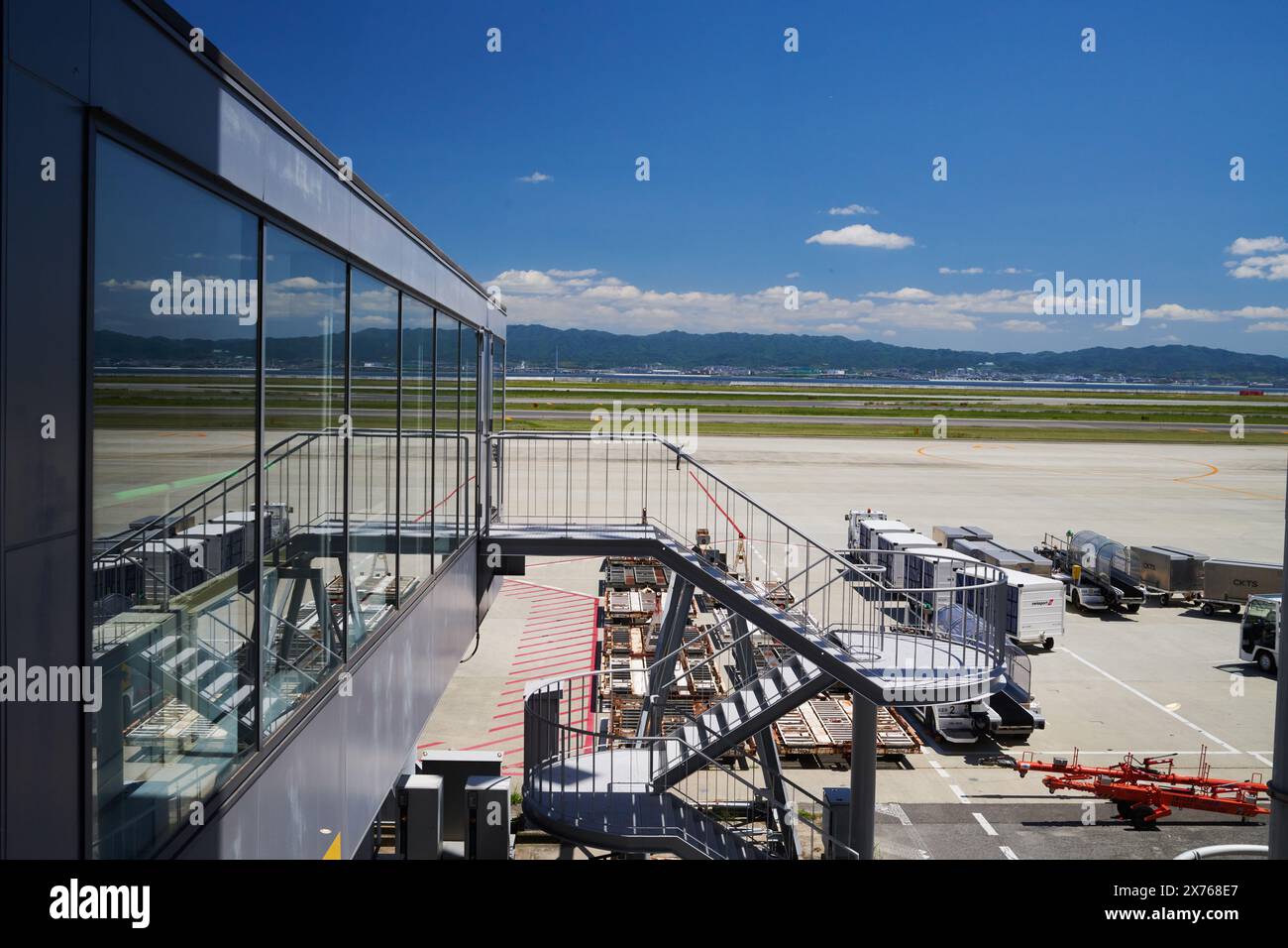 Runway at Kansai Airport in Osaka with reflection in glass Stock Photo ...