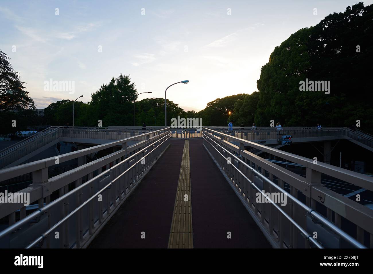 Pedestrian food bridge across a road near Harajuku Stadium in Tokyo ...
