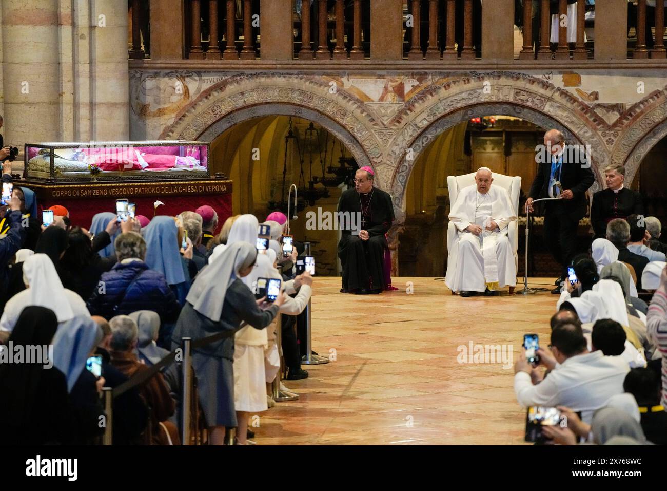 The relics of St.Zeno, left, are exposed as Pope Francis delivers his ...
