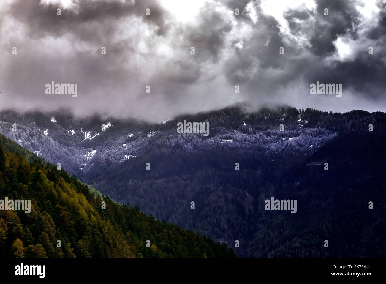 Alpine Peaks with Remnants of Snow and Visible Snow Line in Dark Clouds ...