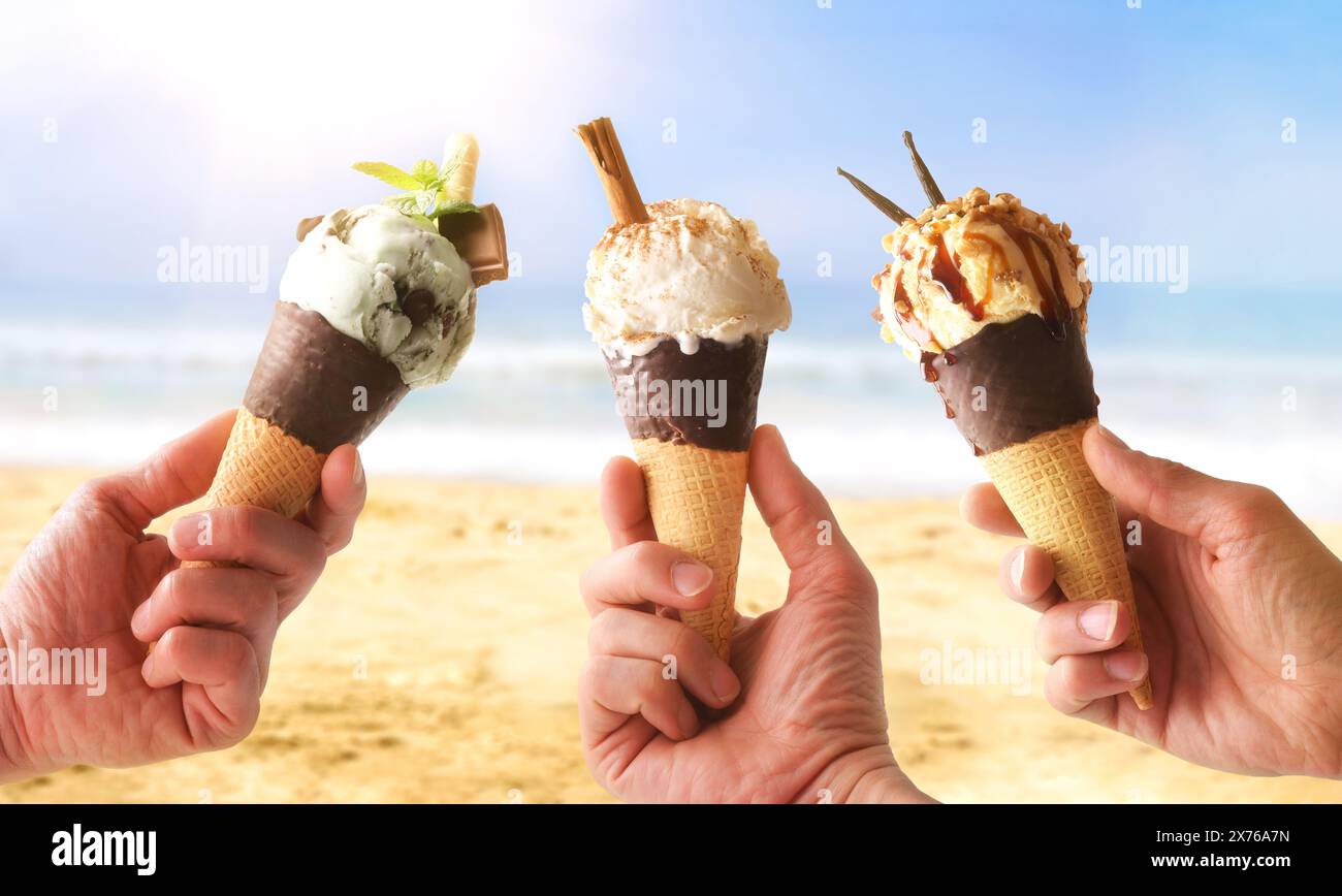 Three hands holding ice cream cones of various vacation flavors on the ...
