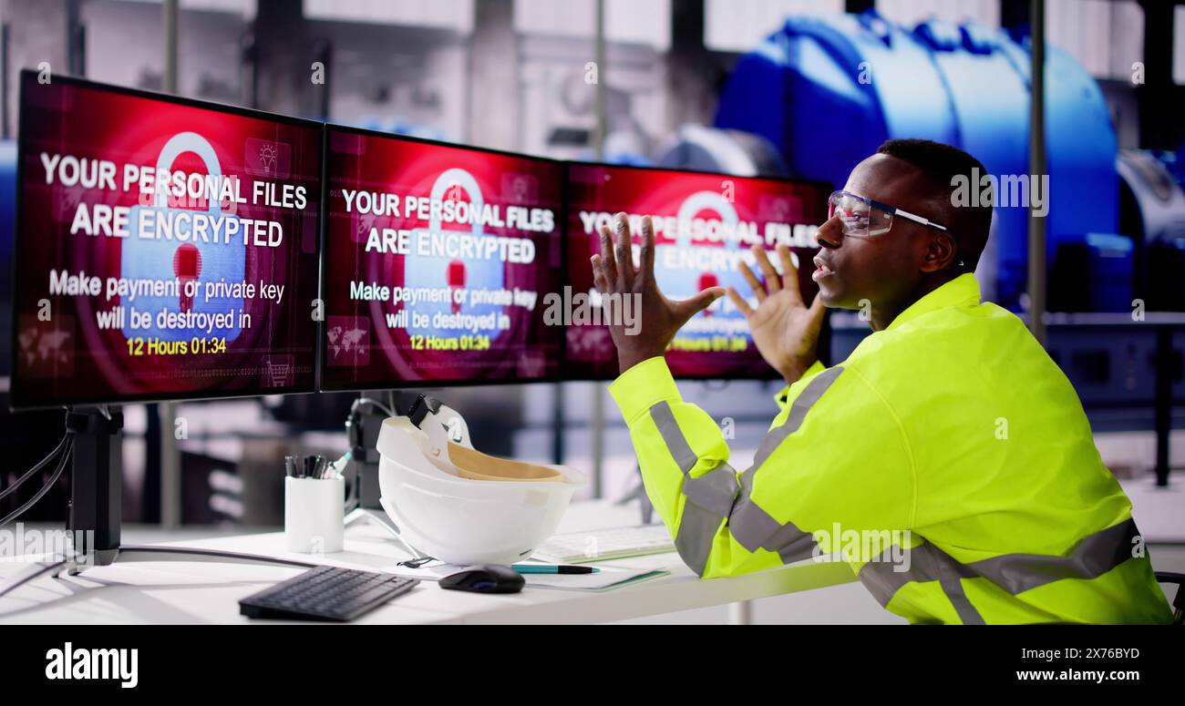 Power Plant Worker Confused With Malware Attack. Security Breach Stock ...
