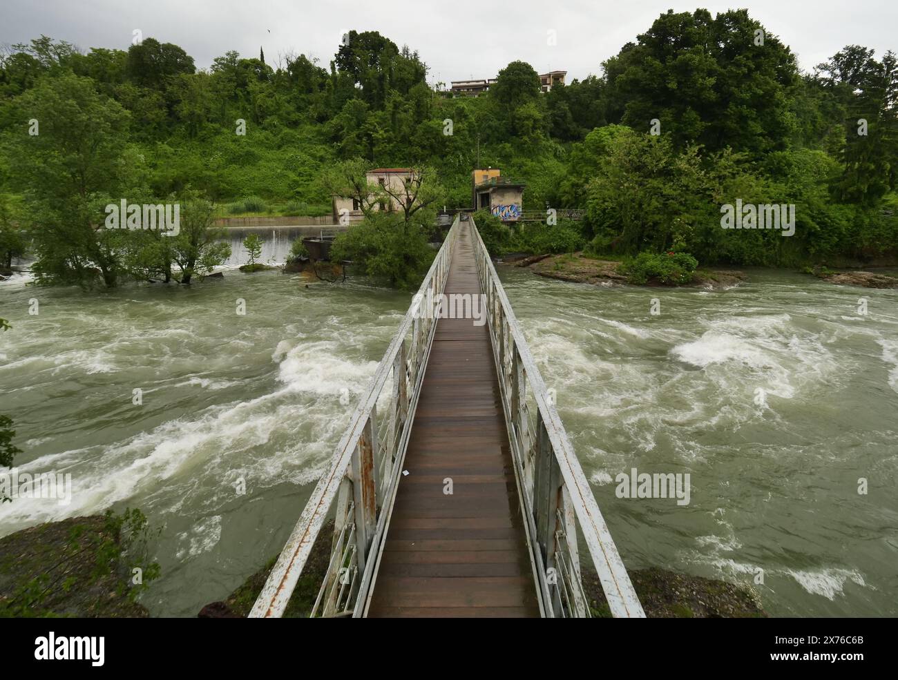 Pedestrian bridge over the Adda river in flood after rain Stock Photo ...