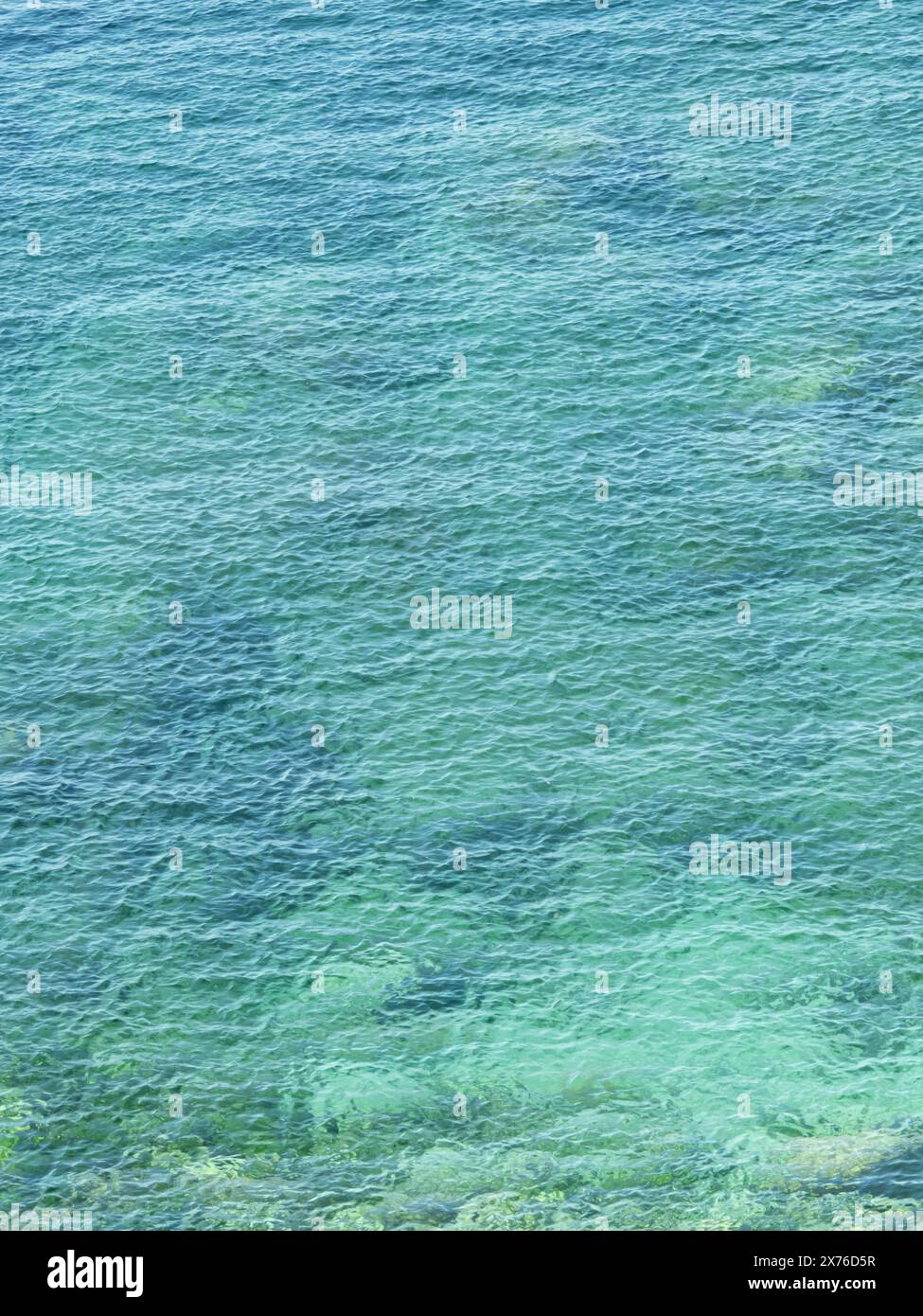 Vertical bright turquoise sea ripples background. Sea surface wrinkled ...