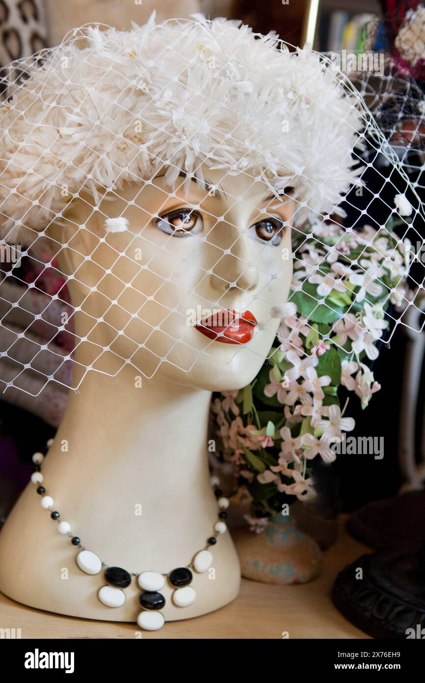 A classic female mannequin bust in a white hat and veil Stock Photo - Alamy