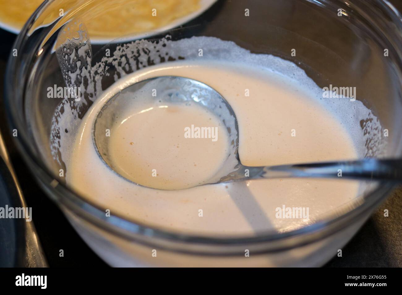 Close up of a lentils batter in glass bowl with a ladle, healthy ...