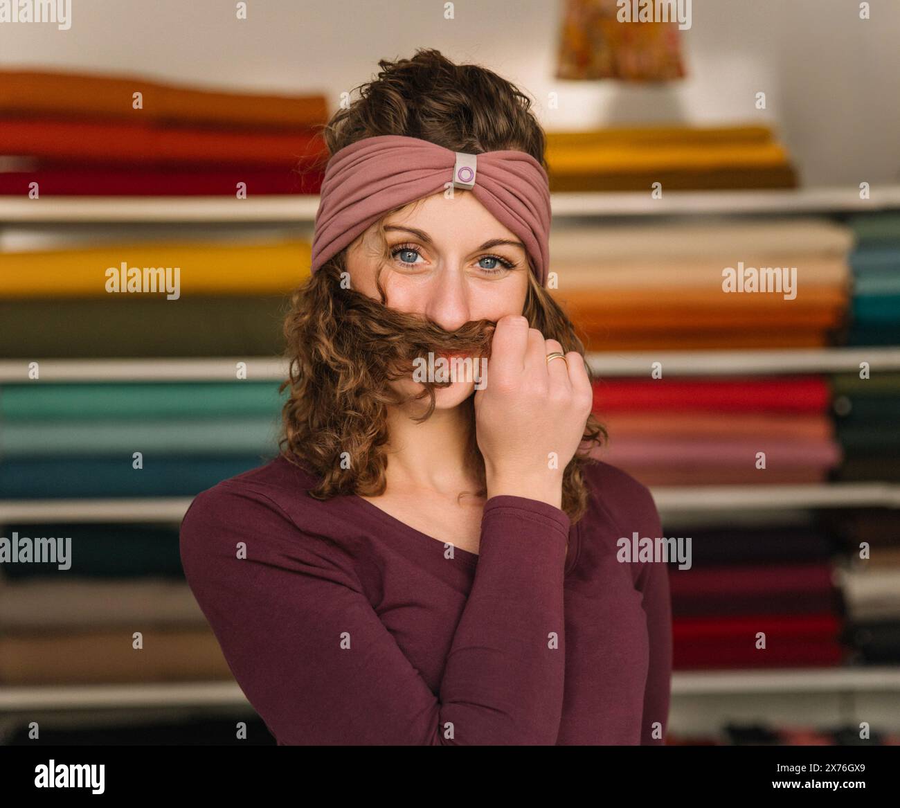 Fashion Designer Having Fun with Hair Mustache in Textile Studio Stock ...