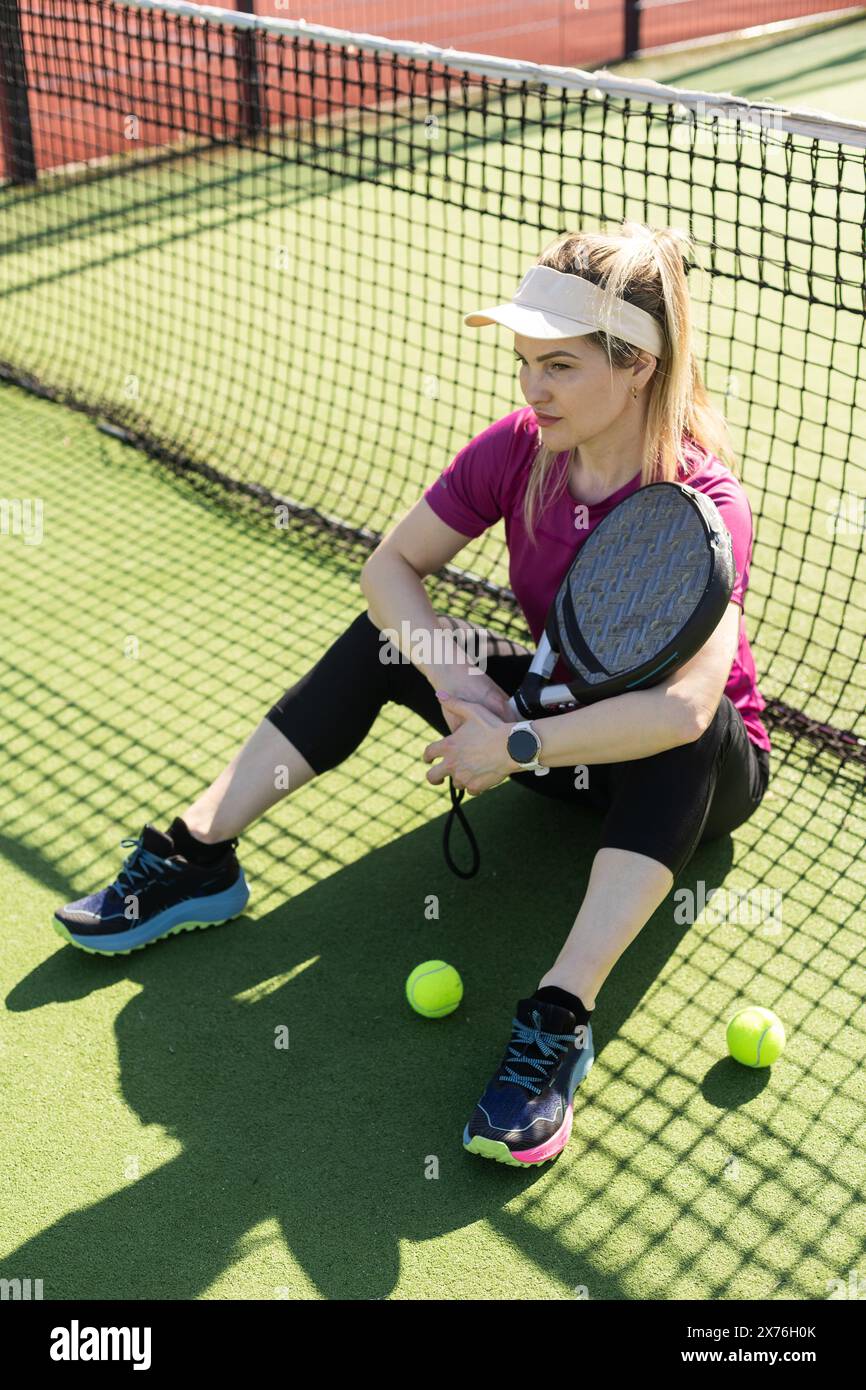 Portrait of attractive woman padel tennis player in outdoor court Stock ...