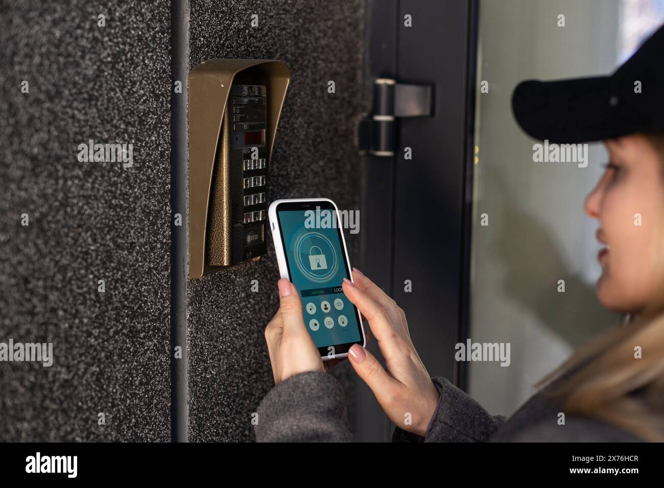 woman uses smartphone to open the door of his house Stock Photo - Alamy