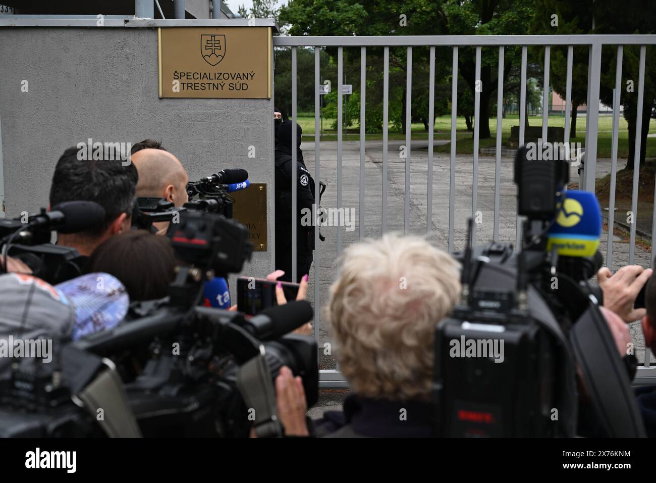 Journalists wait outside the gate of the Special Criminal Court in ...
