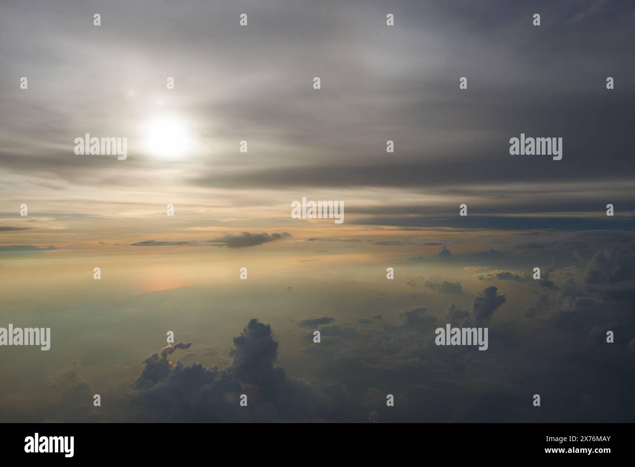 Aerial view seen over clouds from aircraft Stock Photo - Alamy