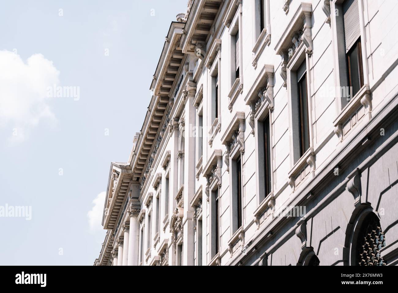ornate white building facade with tall windows and columns Stock Photo ...