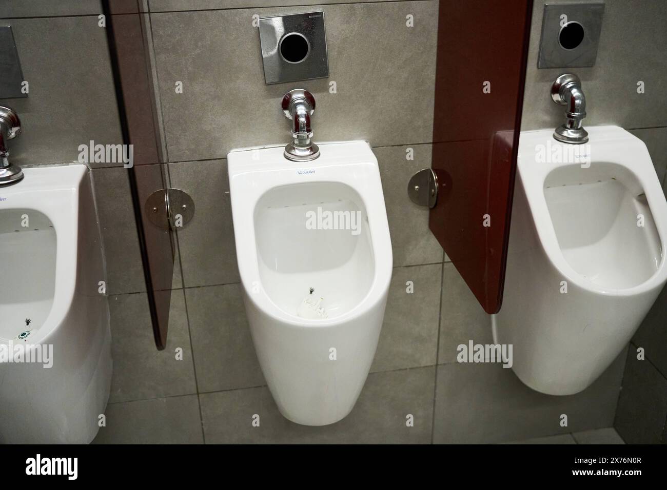 11 May 2024: Urinals in a public restroom for men *** Urinale in einer ...