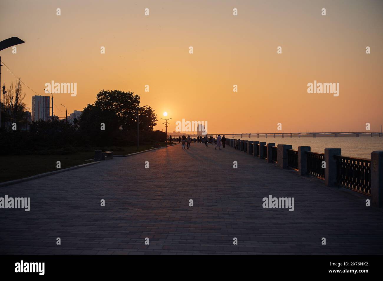 Sunset sky with city in the shadow background Stock Photo - Alamy