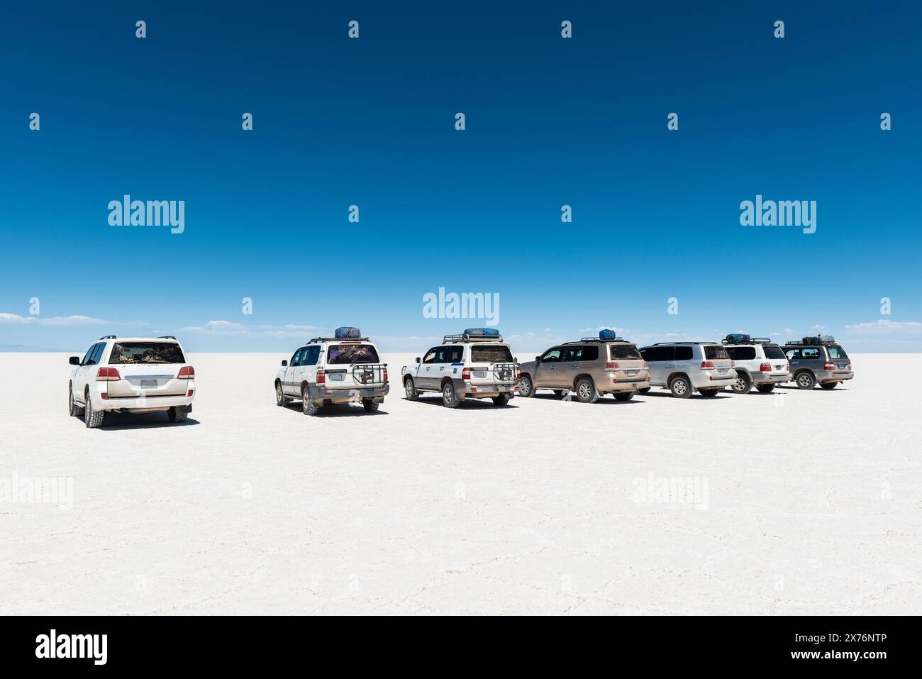 Uyuni salt flat desert transport with sport utility vehicles (SUV ...