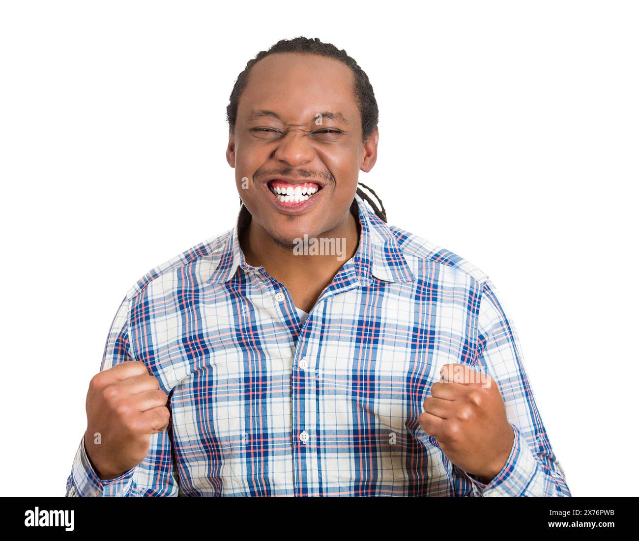 Portrait of a happy young man celebrating success Stock Photo - Alamy