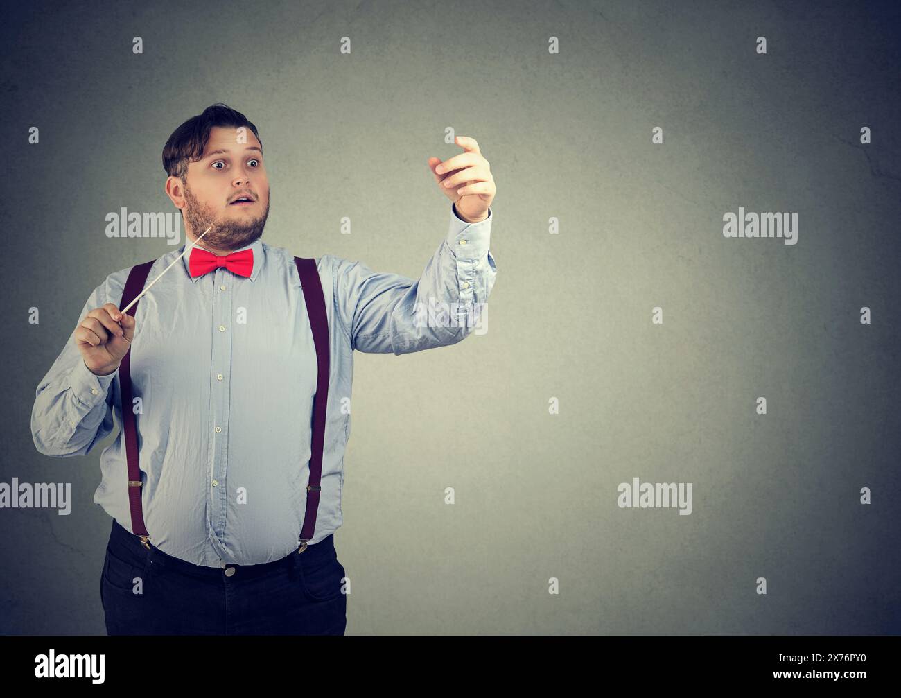 Portrait of an young man orchestra conductor with a baton stick Stock ...