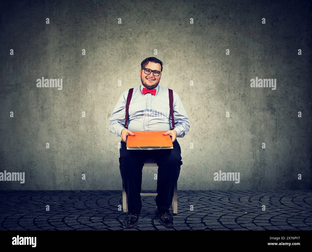 job seeker man waiting for interview meeting sitting on a chair looking ...