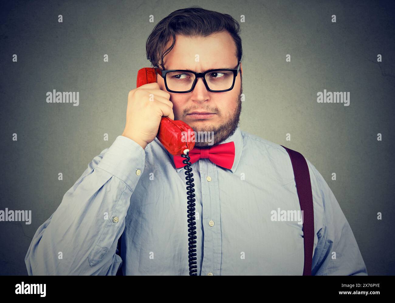 Closeup portrait of a serious grumpy looking business man talking on ...