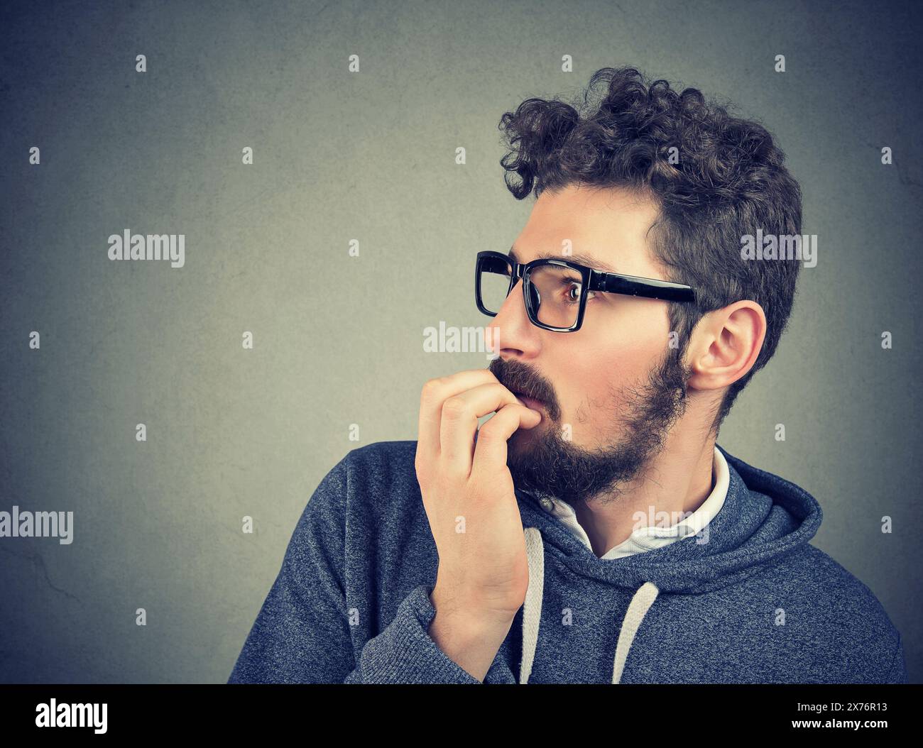 nervous man biting fingernails craving something feeling anxious Stock ...