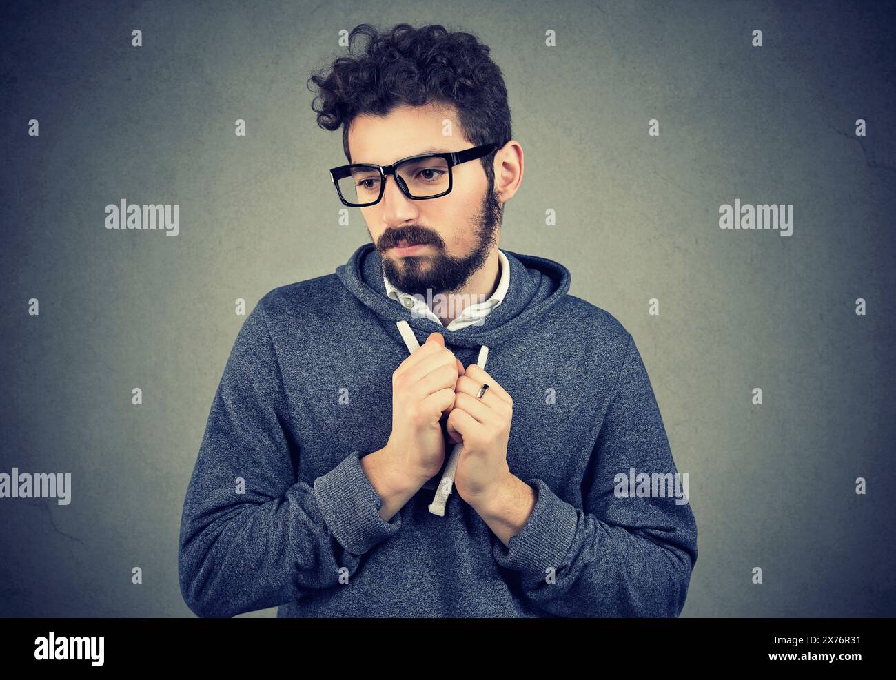 Lack of confidence. Shy anxious young man feels awkward isolated on ...