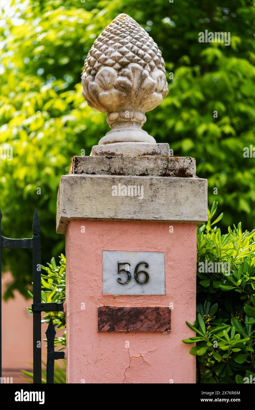 pink pillar with decorative finial and house number Stock Photo - Alamy