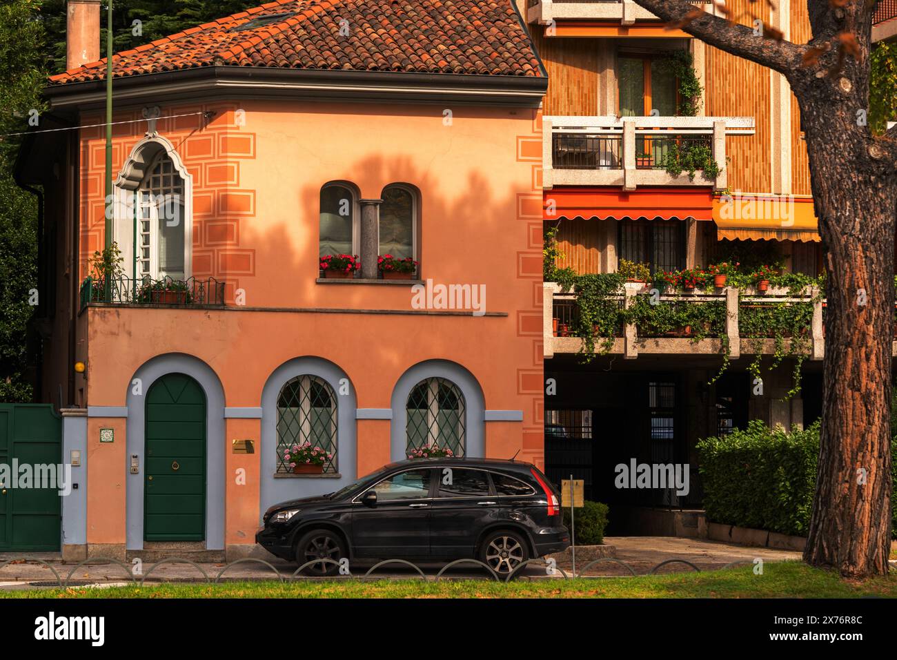 colorful suburban houses with greenery Stock Photo - Alamy