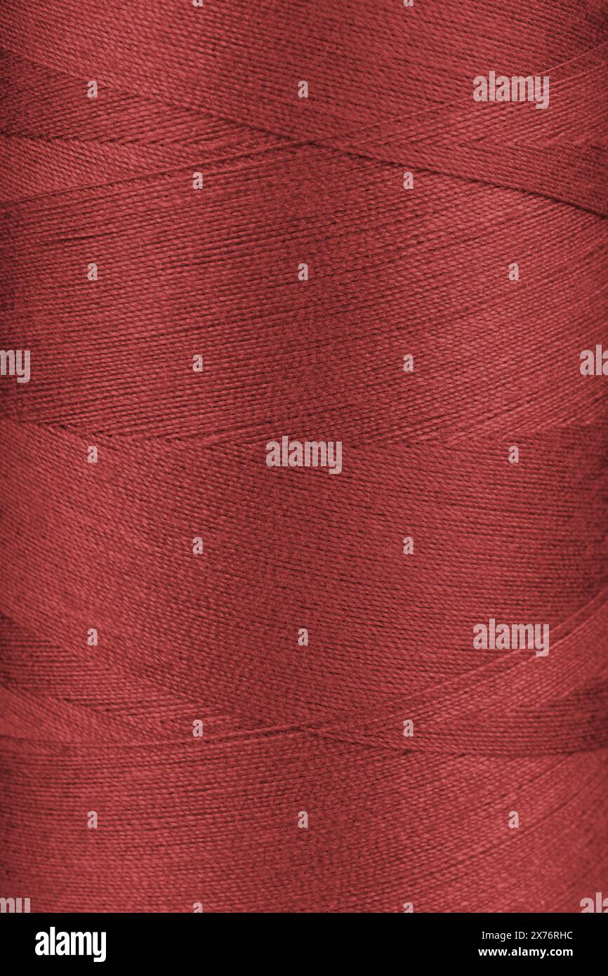 Texture of red color threads in spool close up, macro. Sewing threads ...