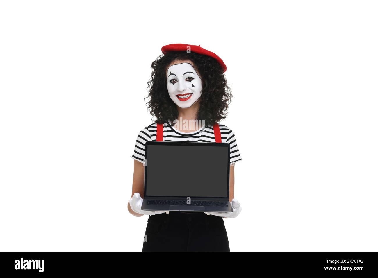 Funny mime with laptop posing on white background Stock Photo - Alamy