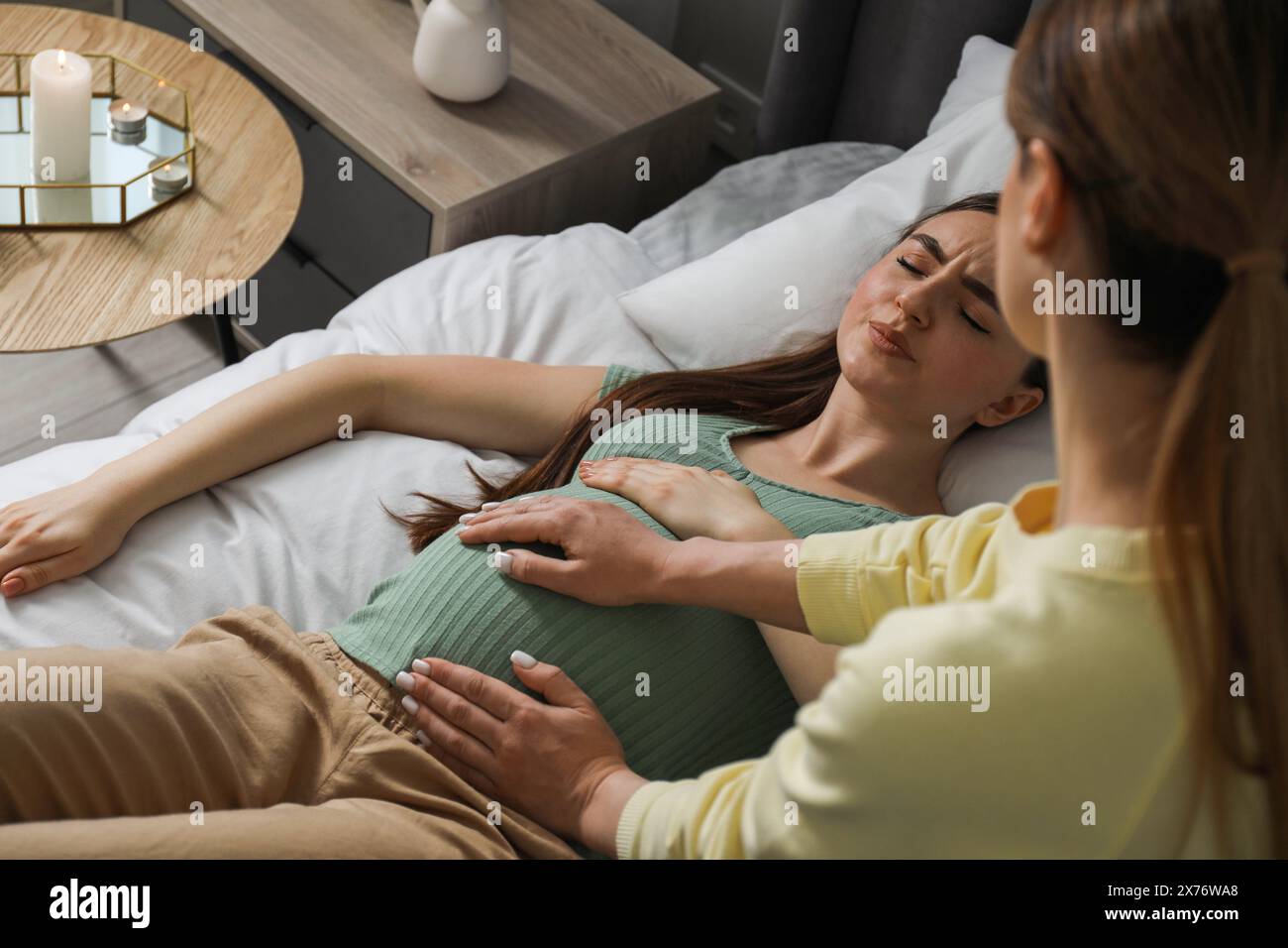 Doula working with pregnant woman indoors. Preparation for child birth Stock Photo - Alamy
