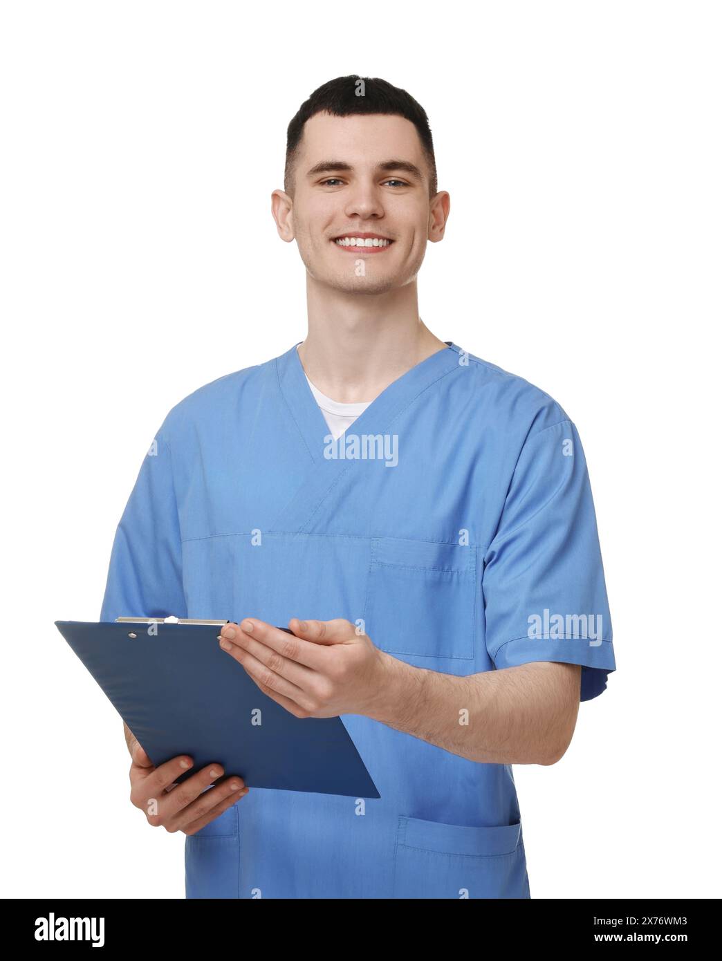 Portrait of smiling medical assistant with clipboard on white ...
