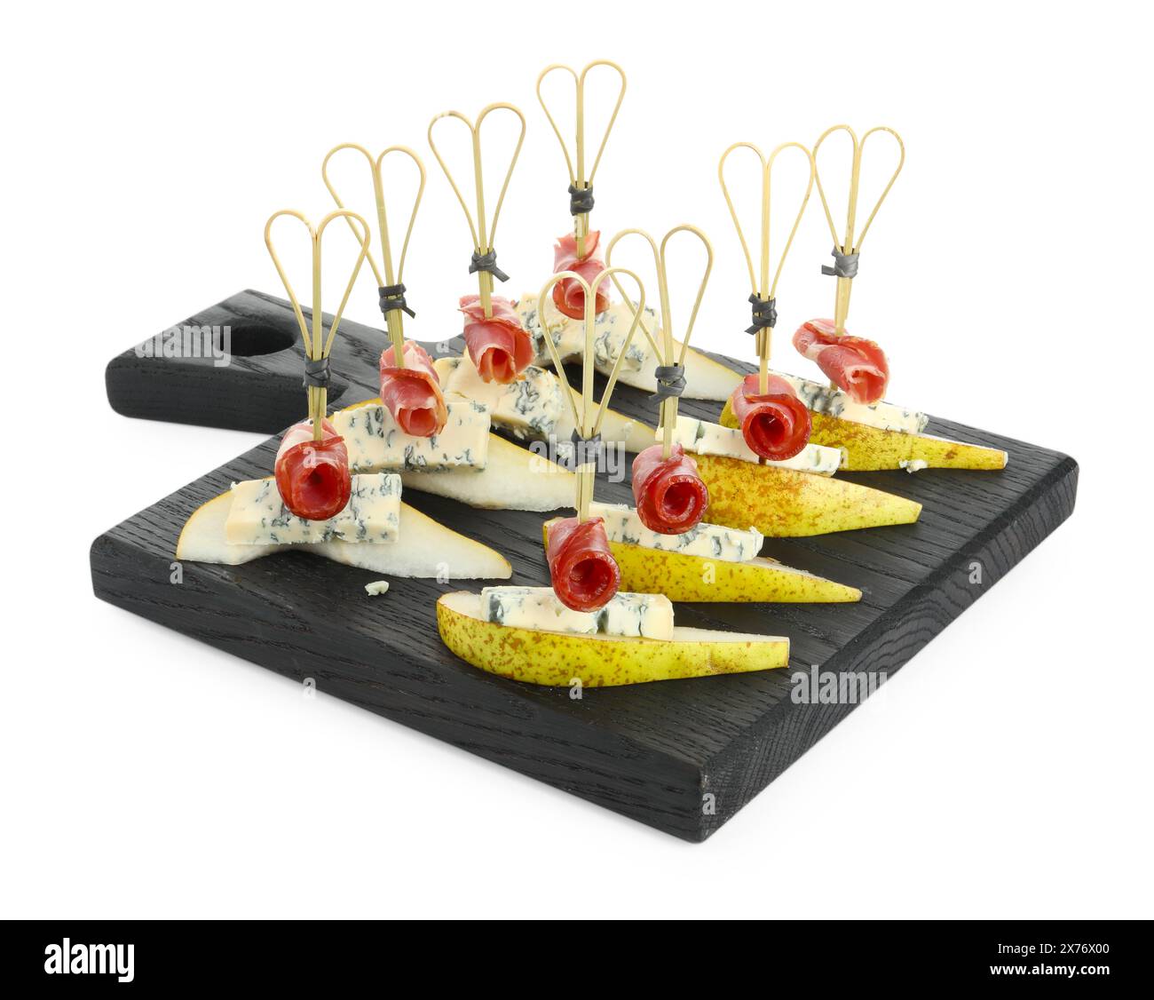 Tasty canapes with pears, blue cheese and prosciutto isolated on white ...