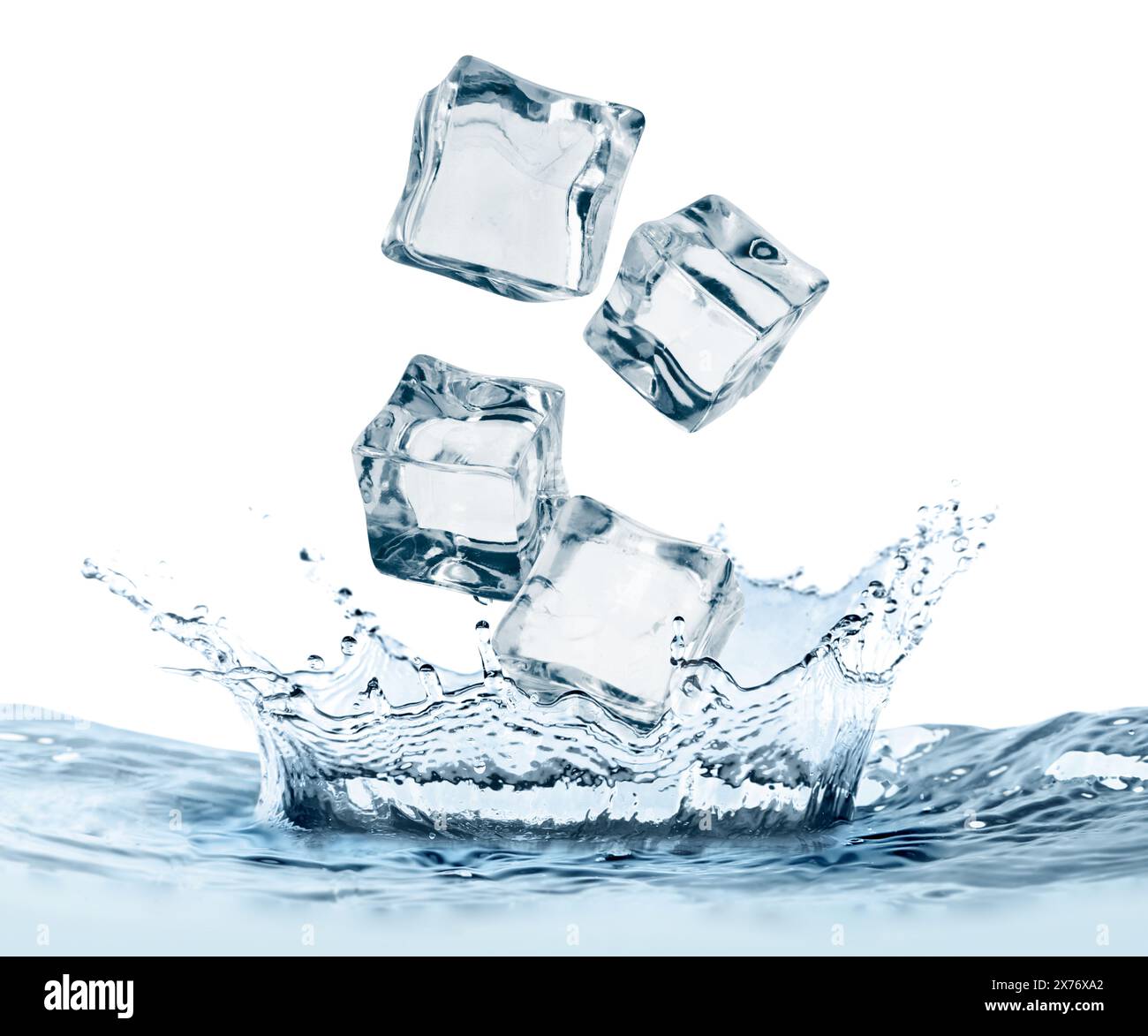 Ice cubes falling into water on white background Stock Photo - Alamy