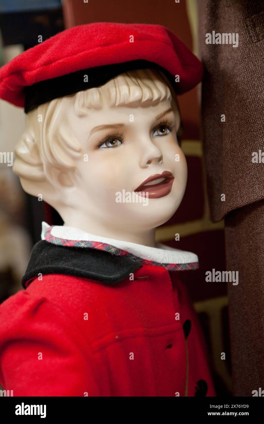A portrait of a classic child mannequin dressed in red Stock Photo - Alamy