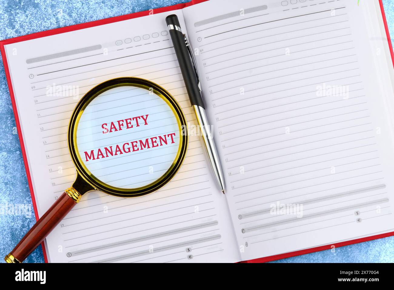 Safety Management text written through a magnifying glass in a business ...