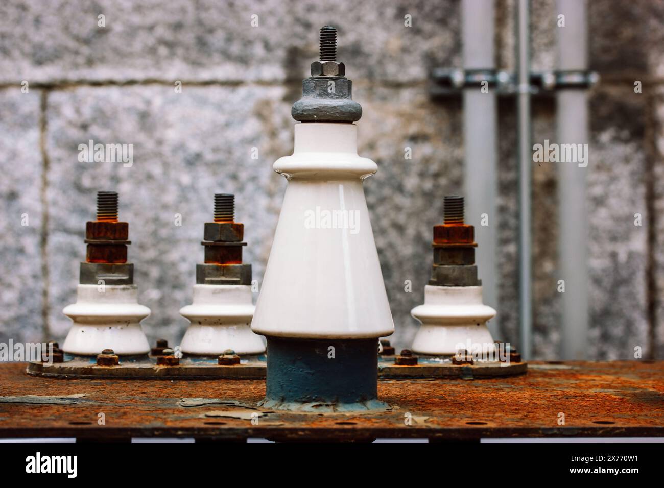 Old rusty bolts, steel nuts on white background. A large rusted bolt ...