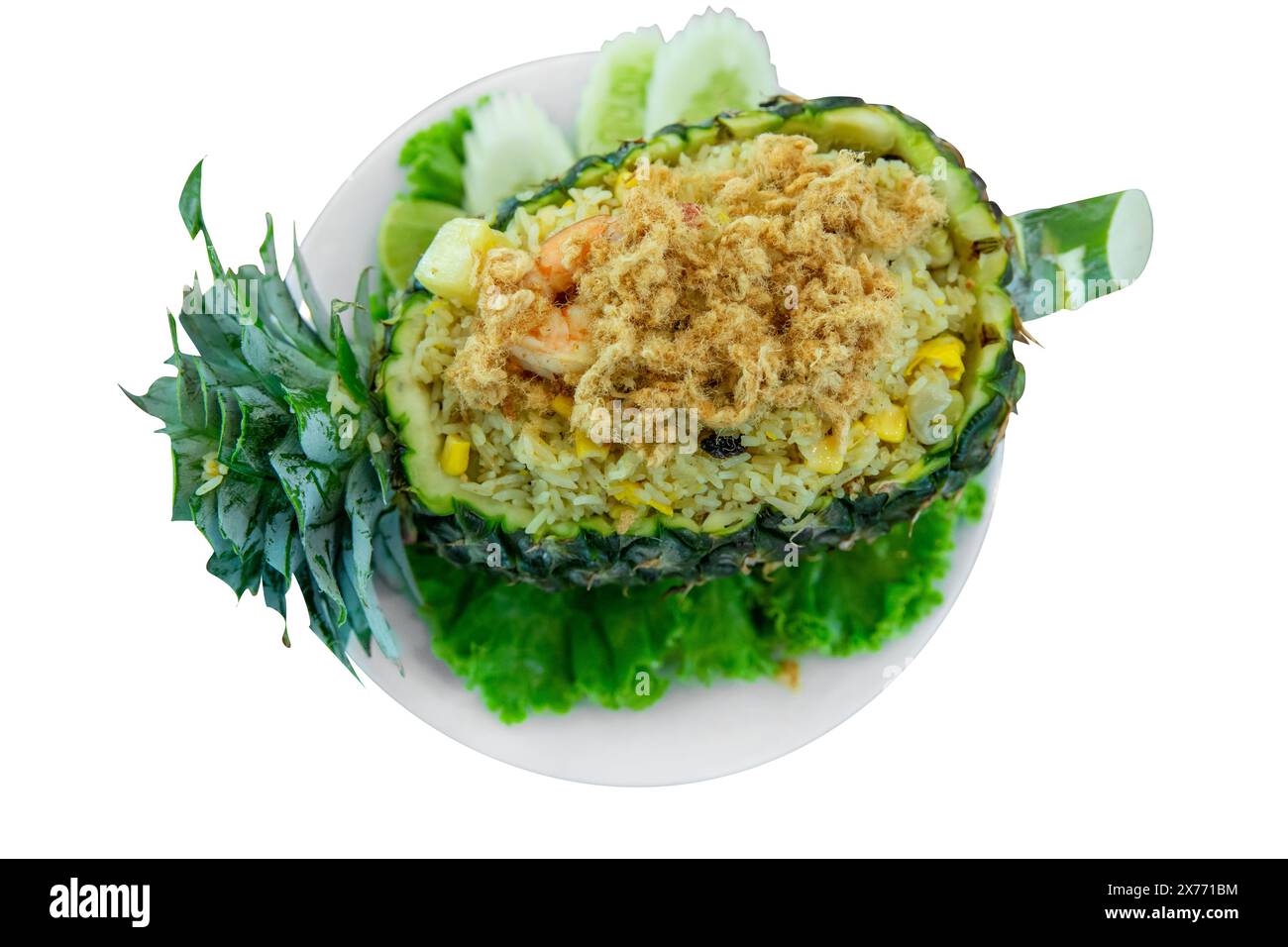 Die cut of pineapple fried rice served inside of a pineapple carved ...