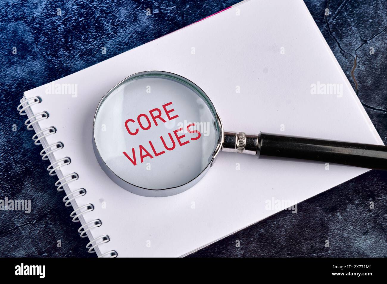 CORE VALUES. ethics concept, text through a magnifying glass in a ...